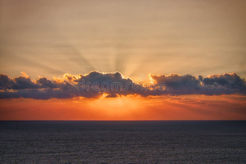 Dramatic Sunrise with Sun Rays Coming through the Clouds Stock Image ...