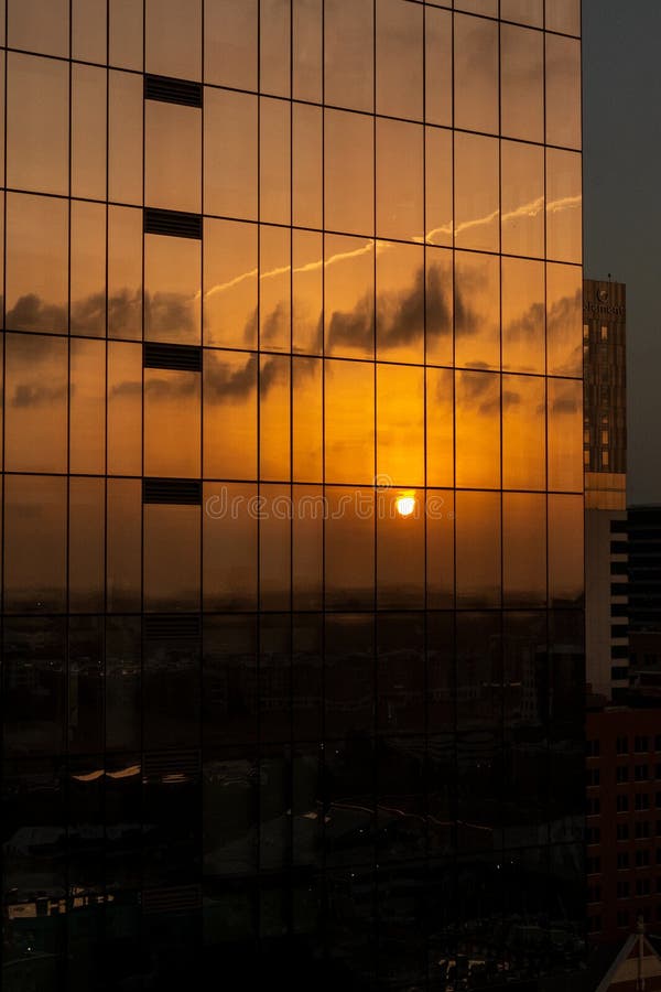 Dramatic Sunrise Reflected in the Windows of a Skyscraper in the ...
