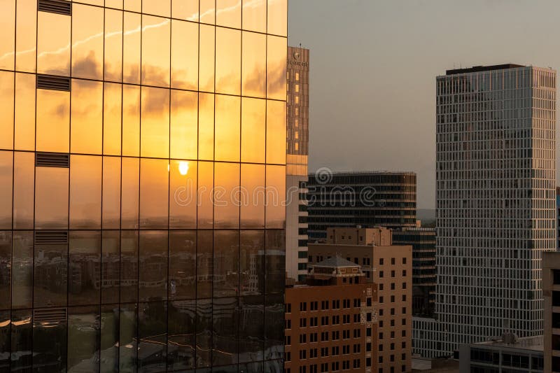 Dramatic Sunrise Reflected in the Windows of a Skyscraper in the ...