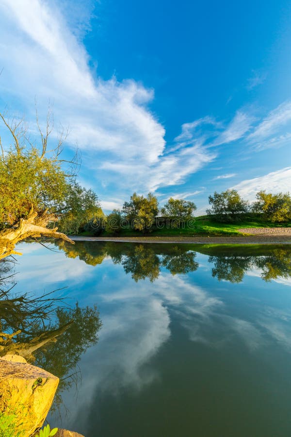 Dramatic Sunrise on Tranquil Lake with Reflections Trees Stock Photo - Image of tranquil, lake ...