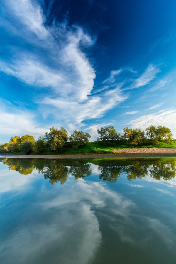 Dramatic Sunrise on Tranquil Lake with Reflections Trees Stock Photo ...