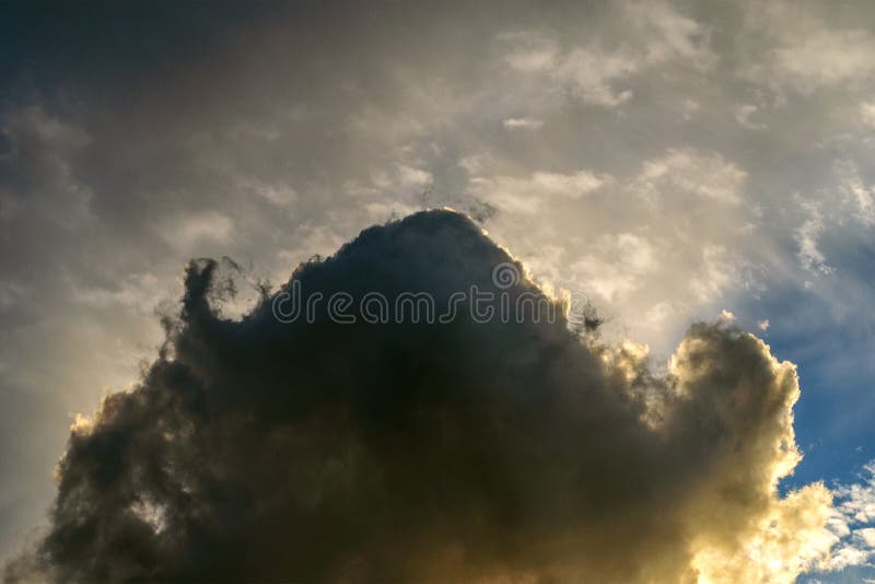 Dramatic Sunset with a Black Cloud that Illuminates the Setting Stock ...