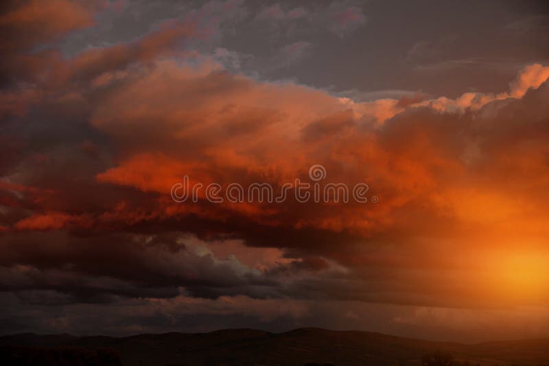 Dramatic Sunset with Dark Clouds and Orange Sunburst Stock Photo ...