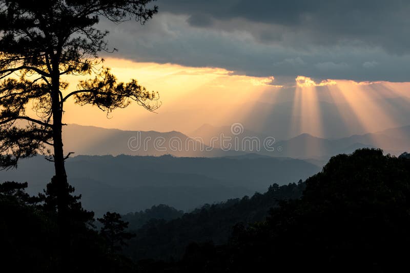Dramatic Sunset with Godlight Shining through the Cloudy Sky Stock ...