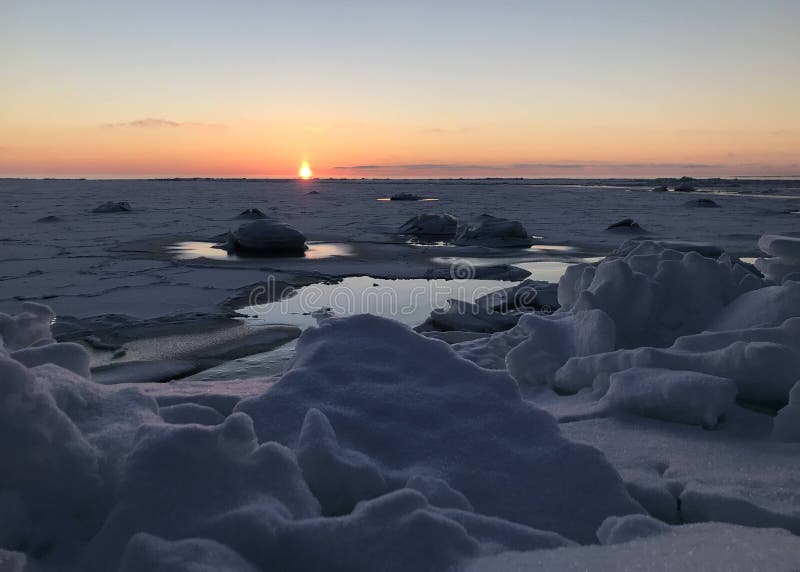 Dramatic Sunset and Ice Blocks on the Seashore. Stock Image - Image of ...