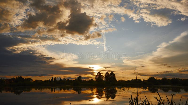 Dramatic Sunset Like Fire in the Sky with Golden Clouds. Stock Image ...