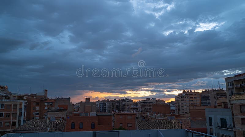 Dramatic Sunset Over City Rooftops, Grey Clouds Stock Photo - Image of ...