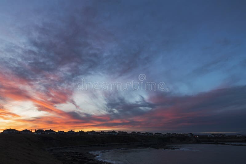 Dramatic Sunset Over Houses with Copy Space Stock Photo - Image of ...