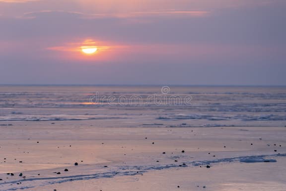 Dramatic Sunset Over the Icy Surface of the Sea Stock Photo - Image of ...