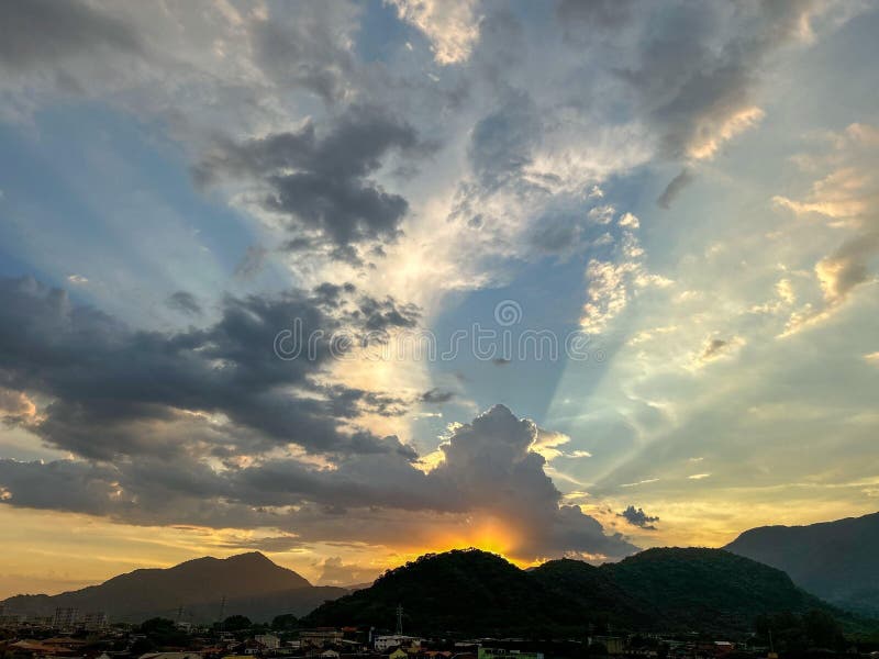 Dramatic Sunset Over Mountainous Landscape Stock Image - Image of rays ...