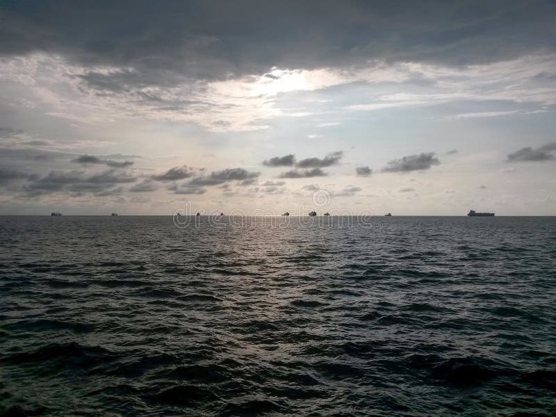 Dramatic Sunset Over the Ocean with Vessel Stock Image - Image of ...