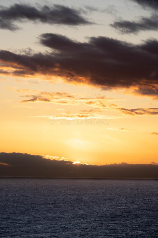 A Dramatic Sunset Over the Ocean with Colorful Skies Stock Image ...