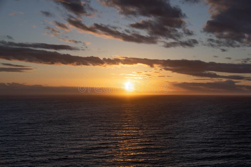 A Dramatic Sunset Over the Ocean with Colorful Skies Stock Image ...