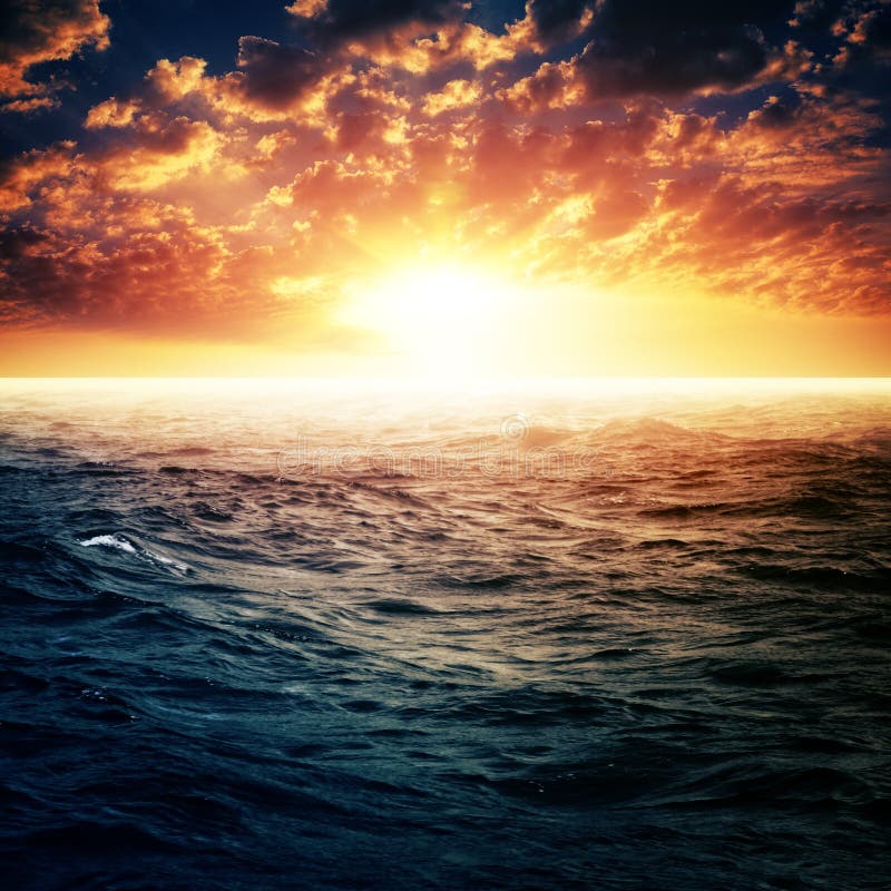 Dramatic Sunset Over Ocean Surface Stock Photo - Image of dramatic ...