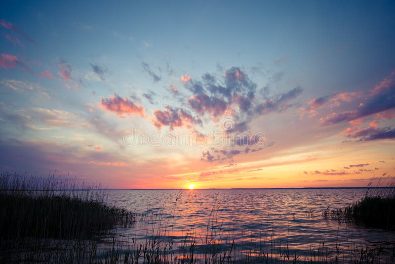 Dramatic sunset stock image. Image of ocean, pond, sunrise - 57090077