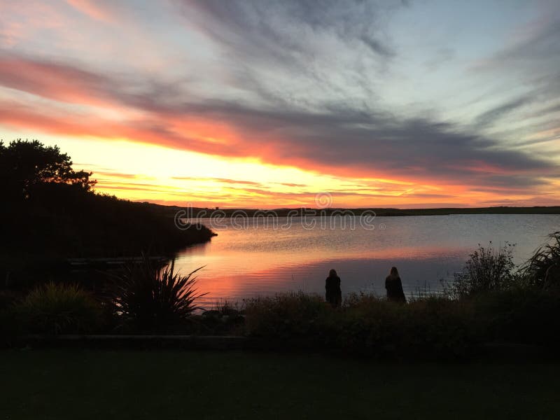 Dramatic Sunset Over a Pond Stock Photo - Image of yellow, dramatic ...