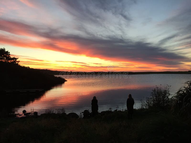 Dramatic Sunset Over a Pond Stock Photo - Image of yellow, dramatic ...