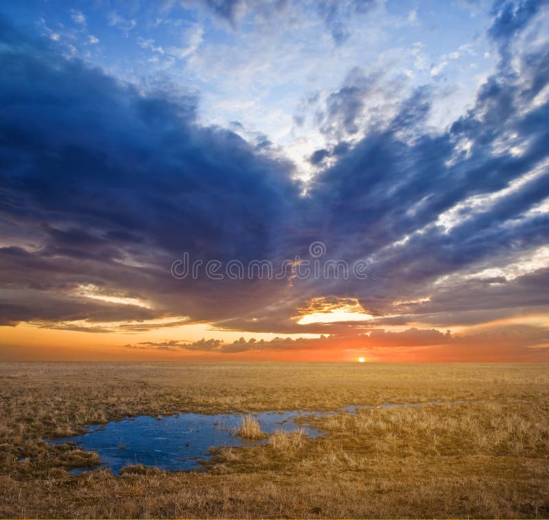 Dramatic Sunset Over a Prairie Stock Image - Image of grass, cloudscape ...