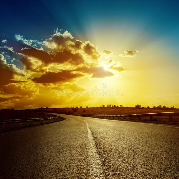 Dramatic sunset over road stock image. Image of line - 34253677