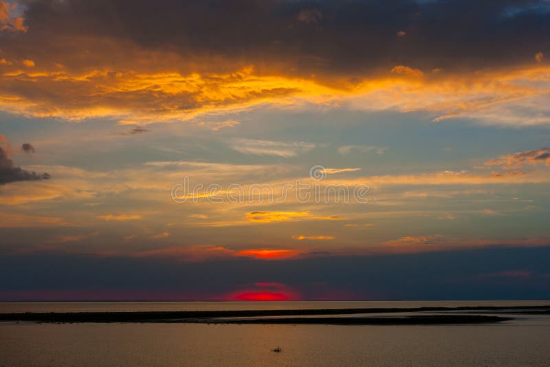 Sunset over ocean beach stock photo. Image of lake, rock - 41842172