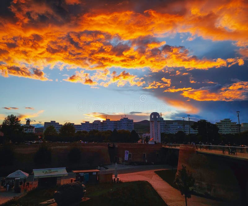 Dramatic Sunset Over a Town with White Buildings Stock Image - Image of ...