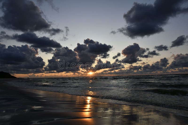 Dramatic Sunset Over Tranquil Beach Stock Photo - Image of vacation ...