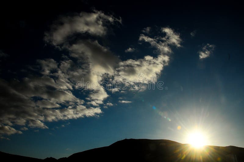 Dramatic Sunset Rays stock image. Image of canary, blue - 47110307