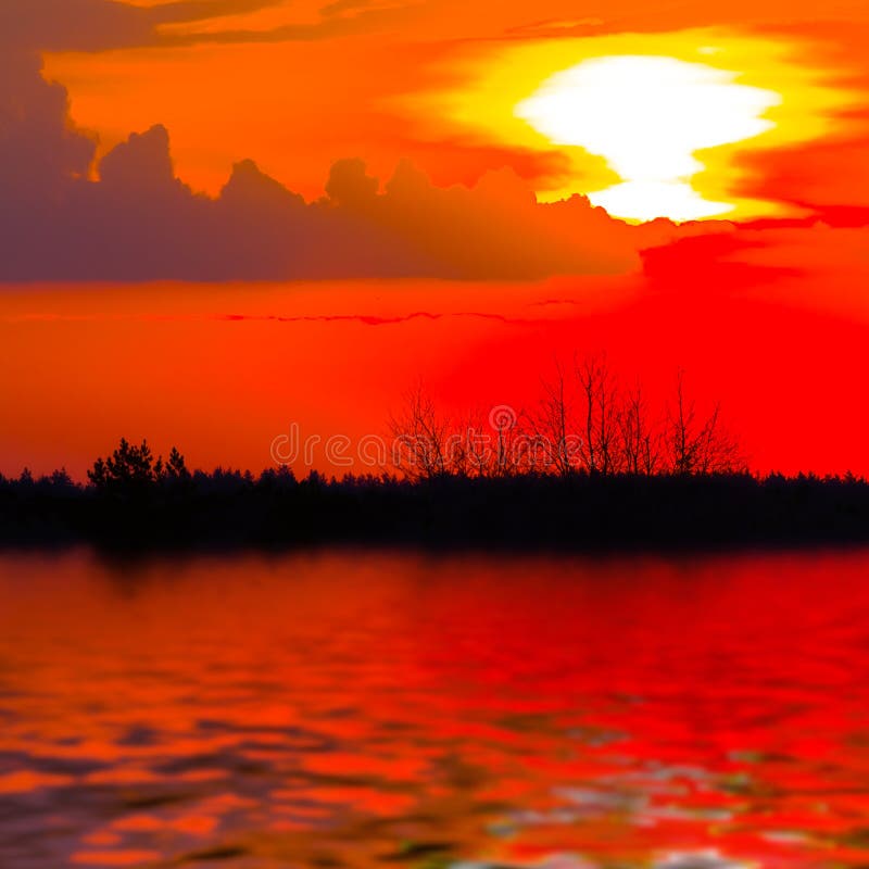 Dramatic Sunset Reflected in a Calm Lake Stock Image - Image of sunrise ...