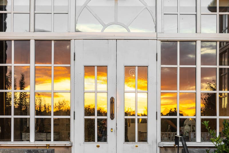 Dramatic Sunset Reflected in Windows Stock Image - Image of ...