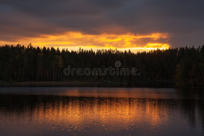 Dramatic Sunset with Reflections Stock Image - Image of vibrant, tree ...