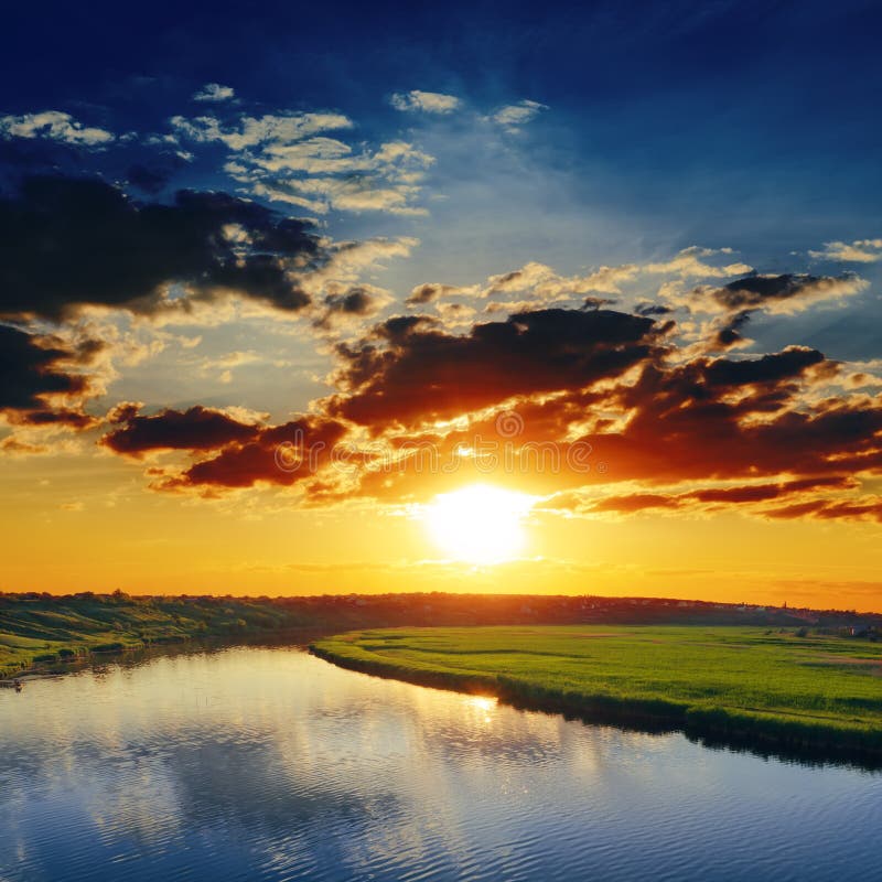 Dramatic sunset and river stock photo. Image of orange - 25213812