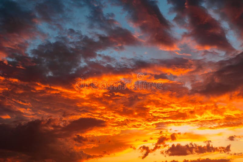 Dramatic Sunset Scene with Partly Cloudy Sky. Orange Clouds Stock Image ...