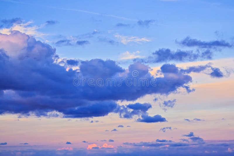 Dramatic Sunset Sky with Bright Multi-colored Cumulus Clouds Stock ...