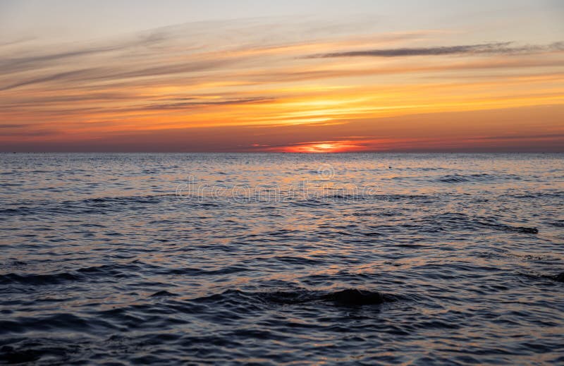 Dramatic Sunset Sky with Clouds. Dramatic Sunset Over the Sea Stock ...