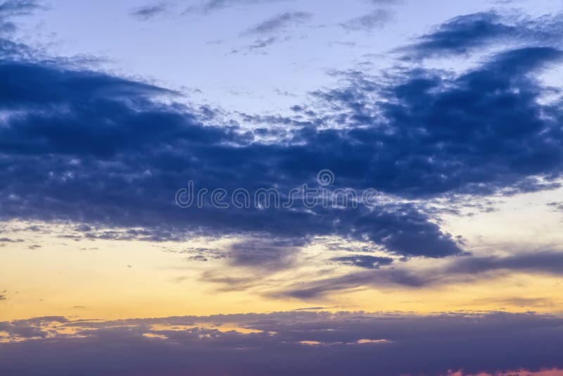 Dramatic Sunset Sky with Yellow Blue Clouds Stock Photo - Image of ...