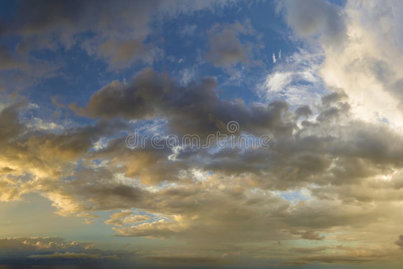Dramatic Sunset Sky Covered with Colorful Yellow Clouds. Panoramic ...
