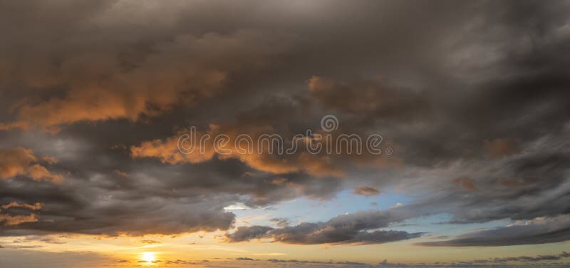 Dramatic Sunset Sky Covered with Colorful Yellow Clouds. Panoramic ...