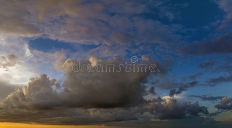 Dramatic Sunset Sky Covered with Colorful Yellow Clouds. Panoramic ...