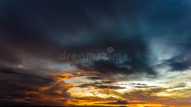 Dramatic Sunset in the Sky through Cumulus Storm Clouds, Stock Photo ...