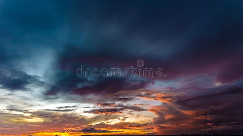 Dramatic Sunset in the Sky through Cumulus Storm Clouds, Stock Photo ...