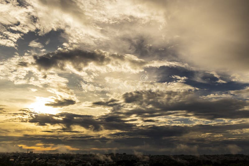 Dramatic Sunset in the Sky through Cumulus Storm Clouds Stock Photo ...