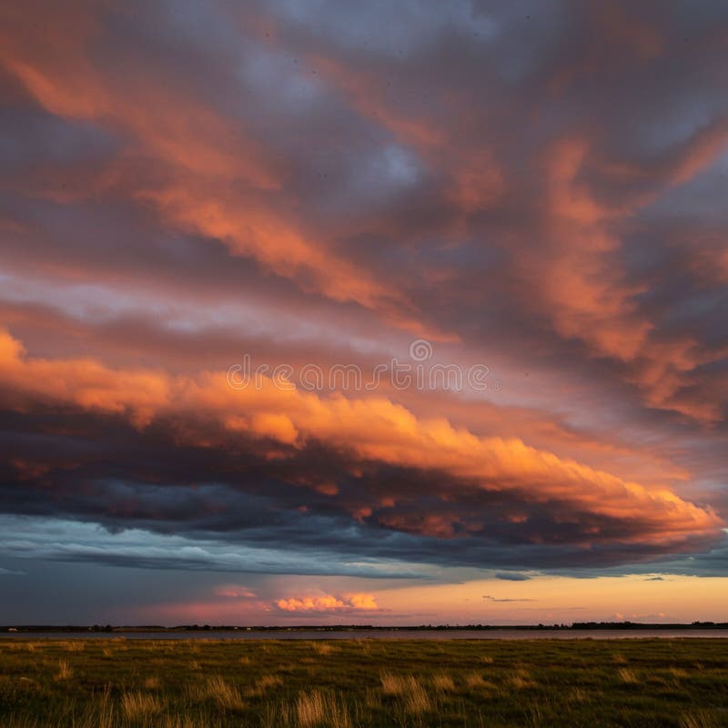 Dramatic Sunset Sky with Dense, Layered Clouds Reflecting Vibrant ...