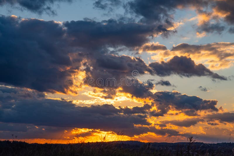 Dramatic Sunset, with Soft Clouds and Warm Hues Stock Photo - Image of ...