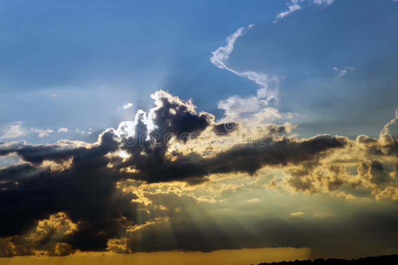 Dramatic Sunset with Sunbeam and Dark Cloud Stock Photo - Image of ...