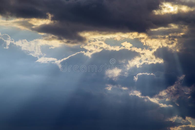 Dramatic Sunset with Sunbeam and Dark Cloud Stock Photo - Image of ...