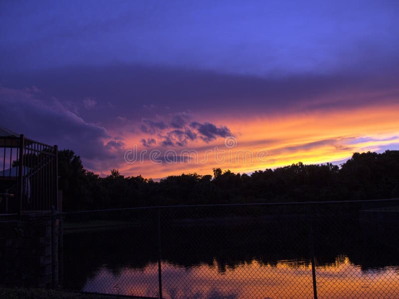 Dramatic Sunset View Over a Lake Stock Photo - Image of dramatic, pond ...