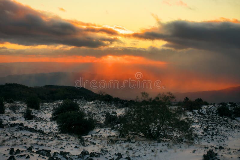 Dramatic Sunset on Volcanic Rock with Snow Stock Image - Image of snow ...
