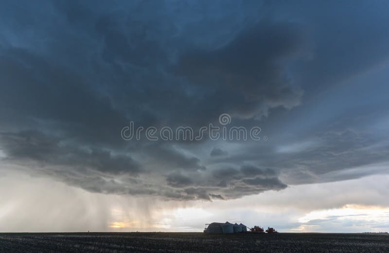 Dramatic Supercell Thunderstorm Looming Over a Farm at Sunset Stock ...