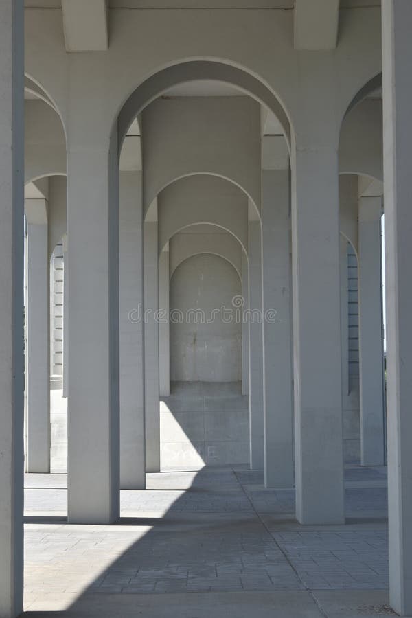 Dramatic Tall Concrete Arches Stock Image - Image of hallway, symmetry ...