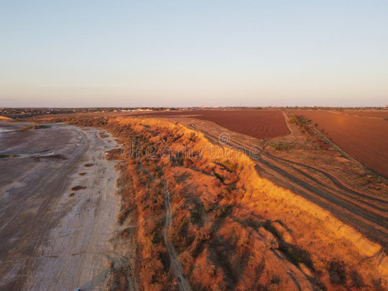 Dramatic Towers and Red Sandstone Cliffs Cast Purple Shadows at Sunset ...